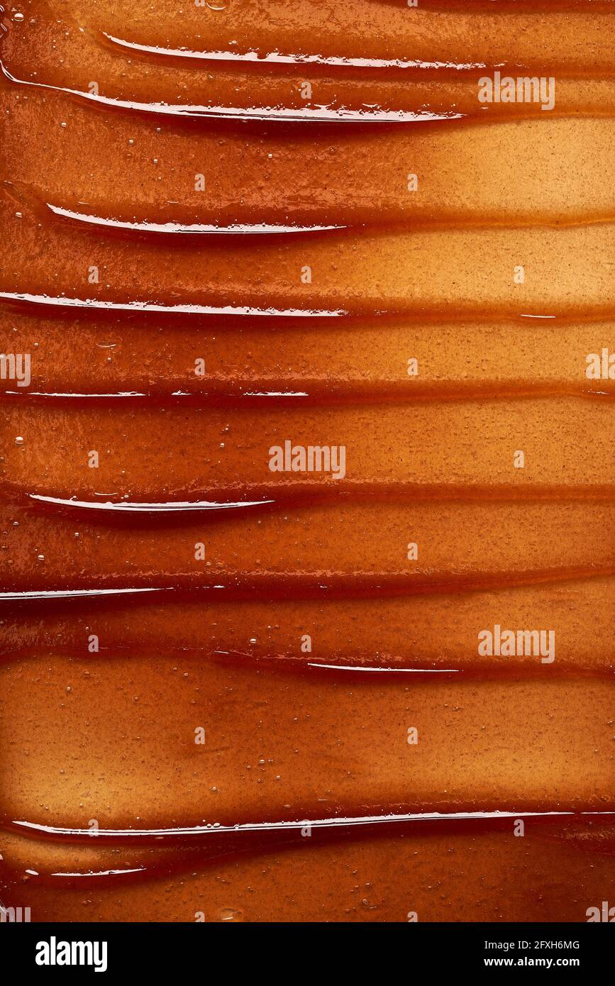 Chocolate colored gel smear and texture. Cosmetic gel or caramel syrup ...