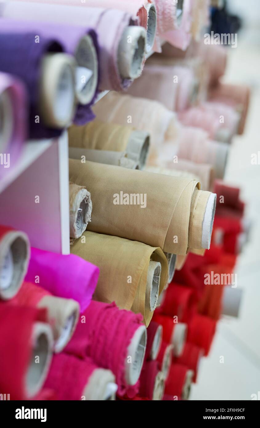 Fabrics retail store, drapery or textile shop. Close-up colorful ...
