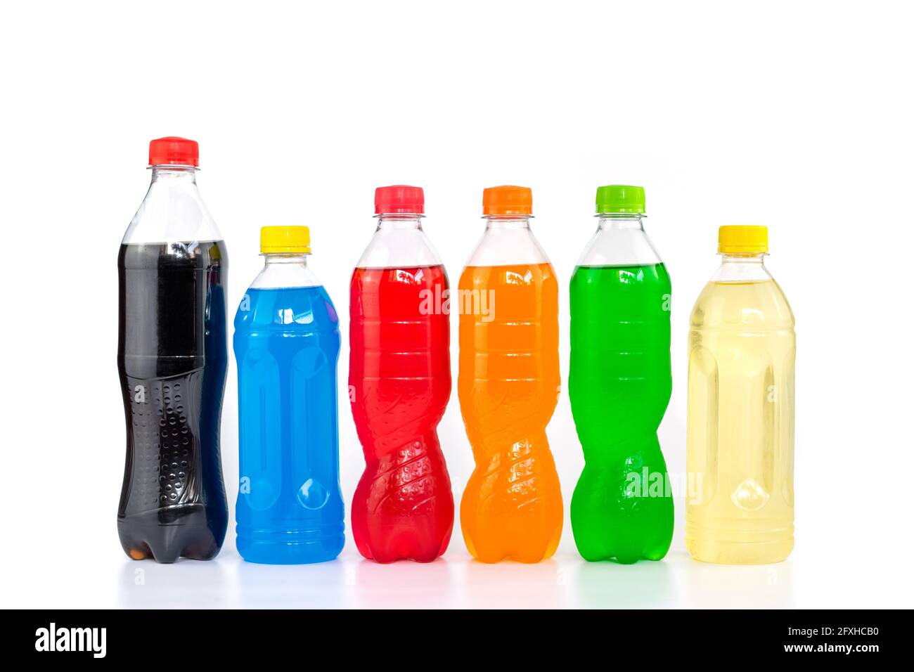 Multi colored drinks in plastic bottles isolated on white background ...
