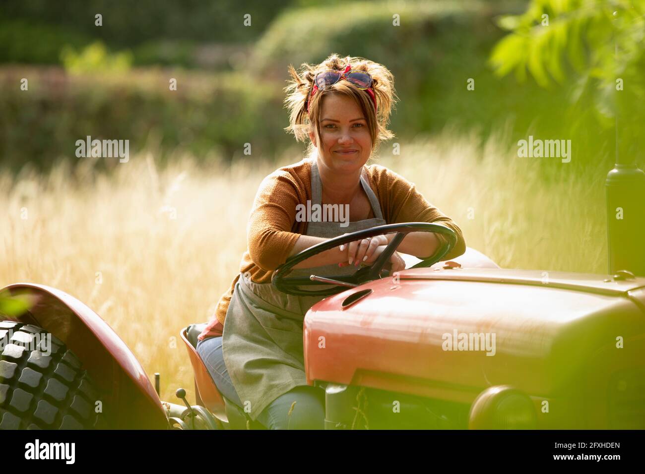 Woman Driving Tractor High Resolution Stock Photography and Images - Alamy