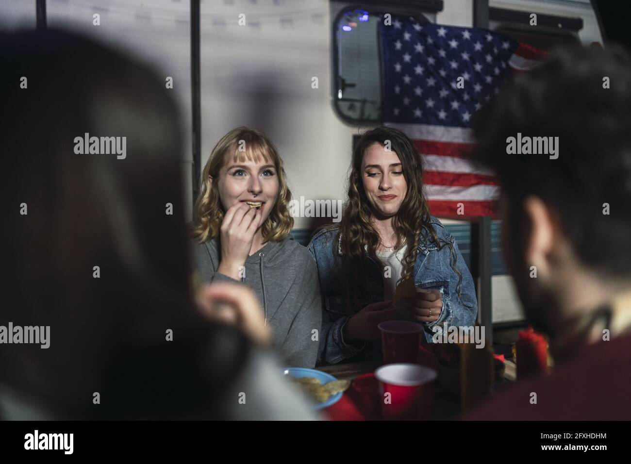 Young Spanish females enjoying their time during BBQ picnic on US ...