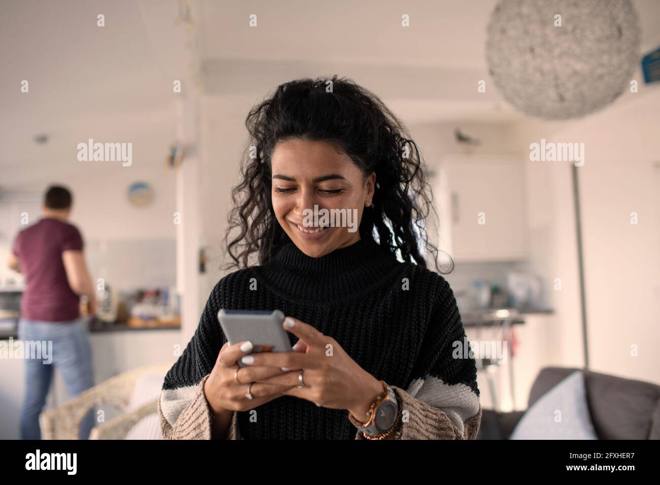 Woman looking smart home hi-res stock photography and images - Alamy