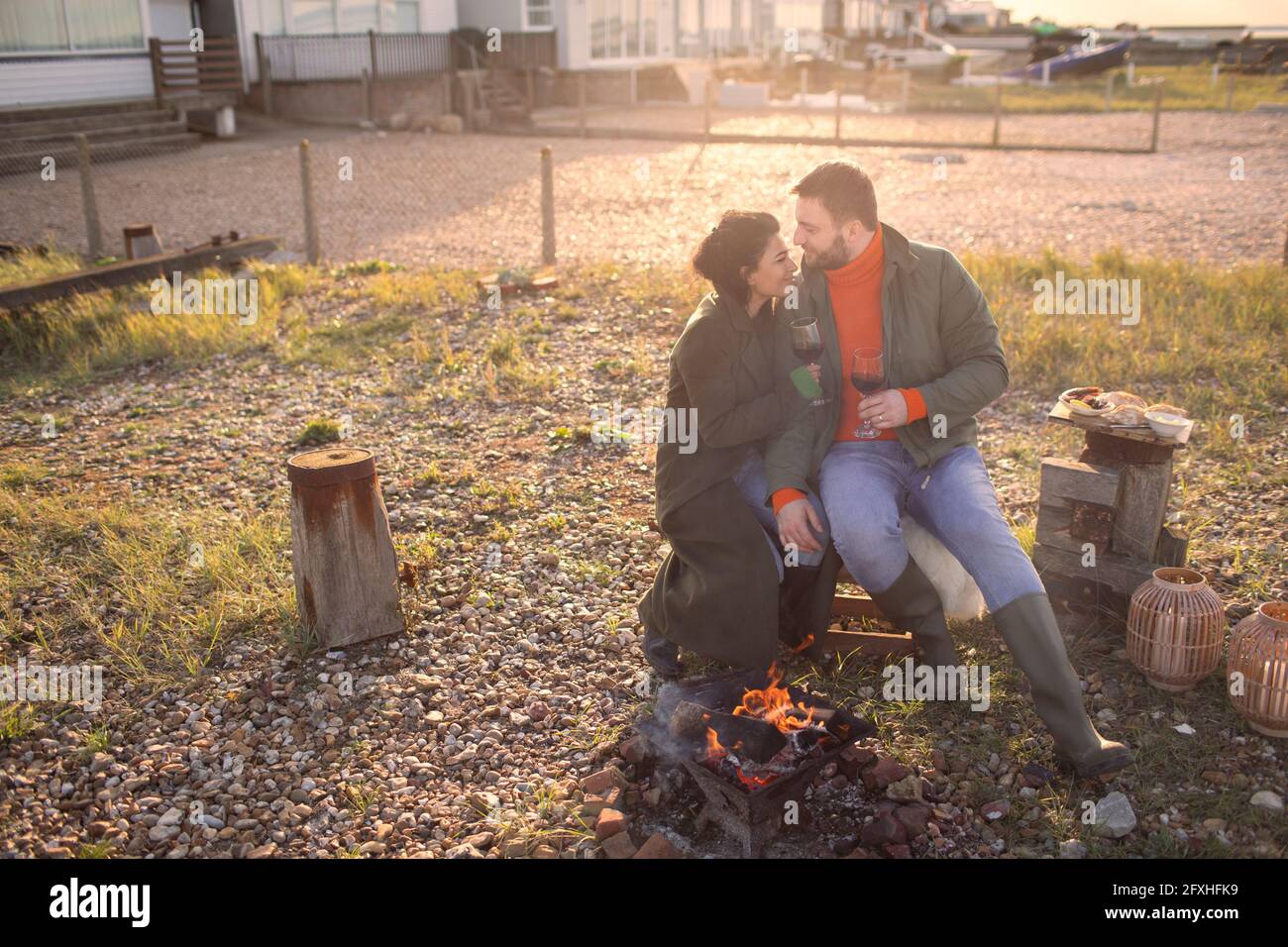 Couple fire on the beach hi-res stock photography and images - Alamy