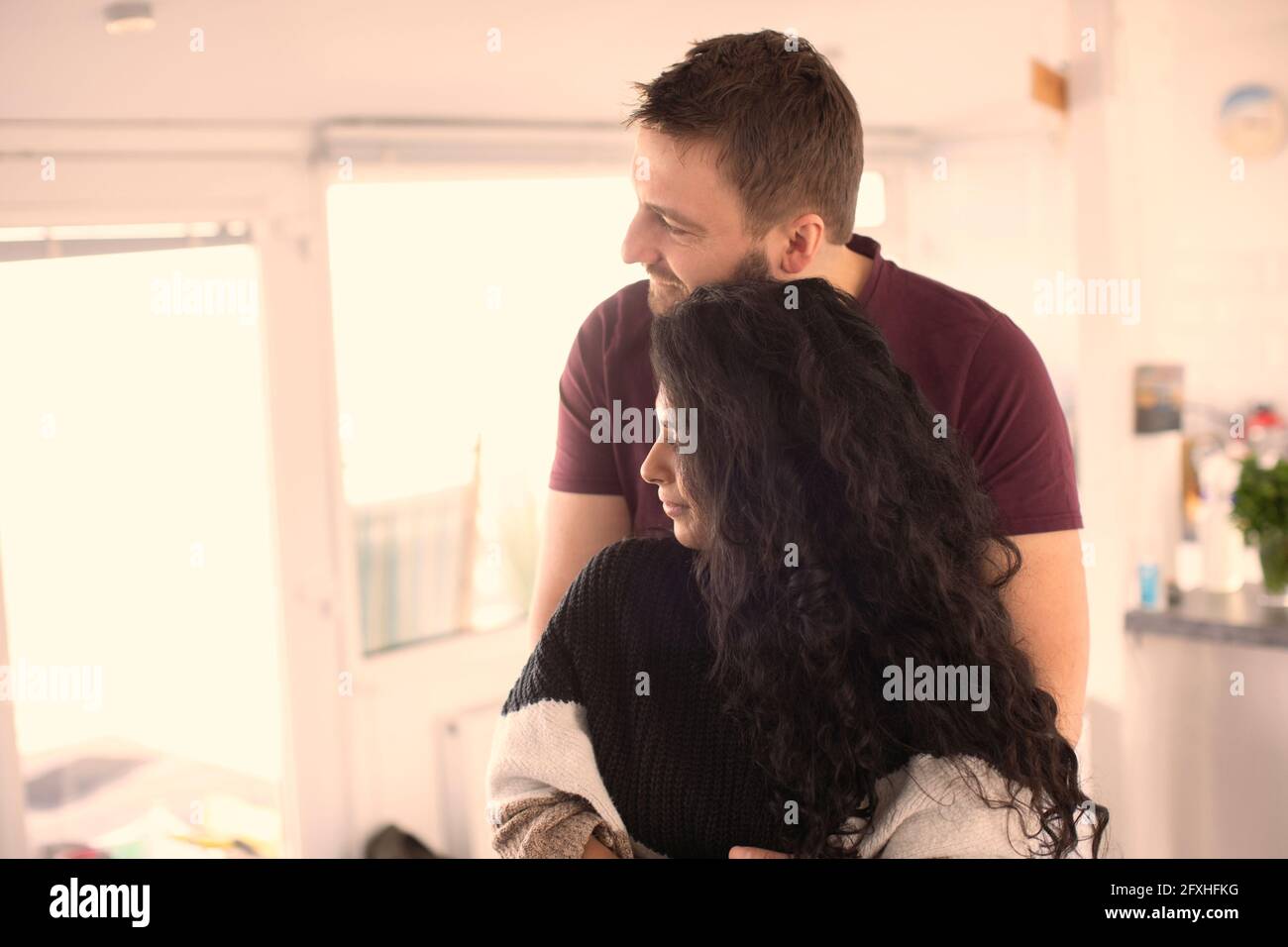 Couple hugging home hi-res stock photography and images - Alamy