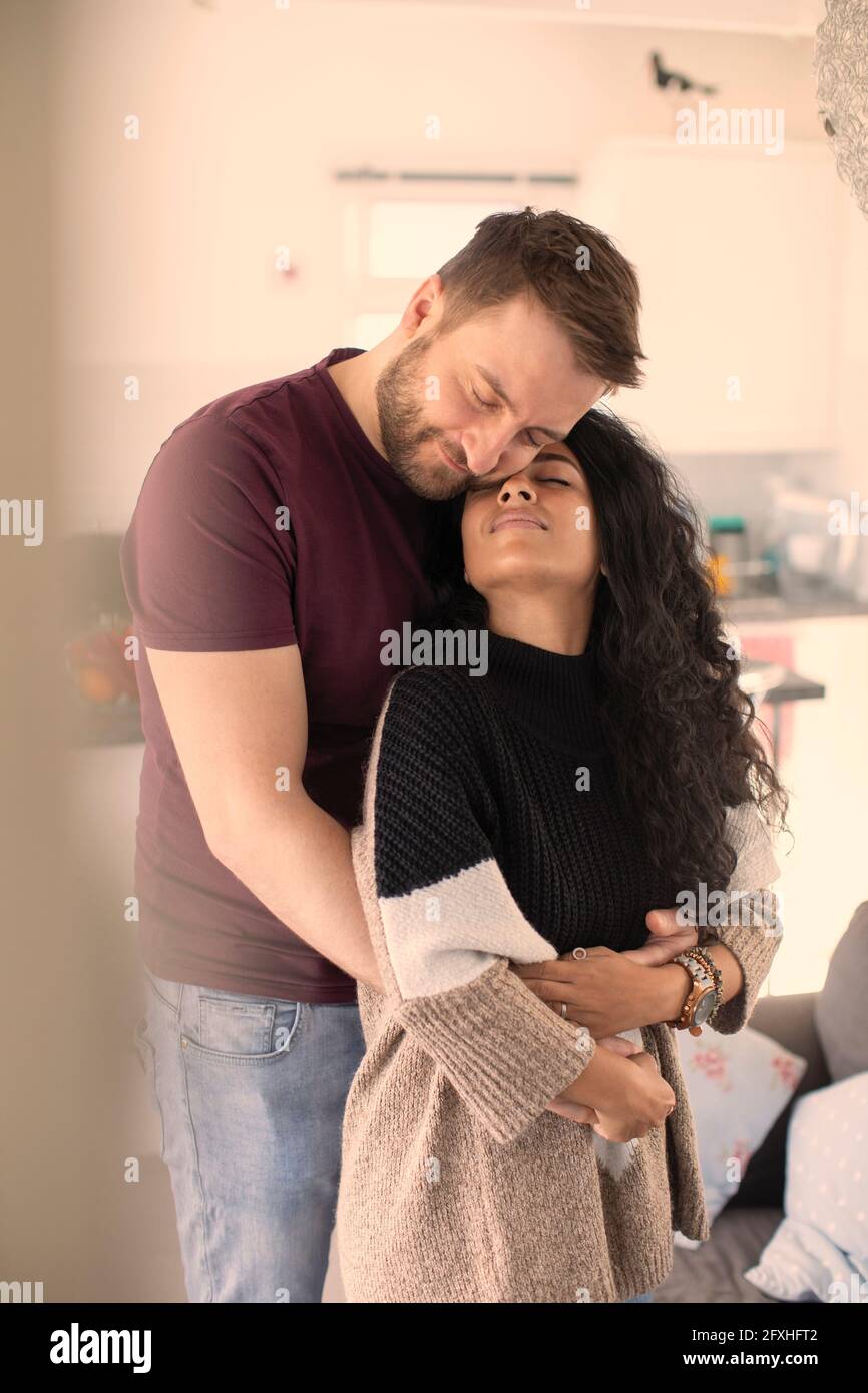 Affectionate serene couple hugging Stock Photo - Alamy