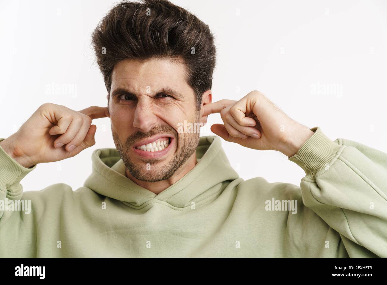 Man plugging ears hi-res stock photography and images - Alamy