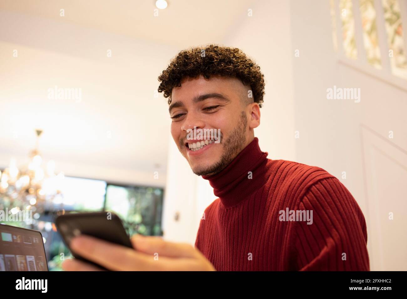 Young happy man using hi-res stock photography and images - Alamy