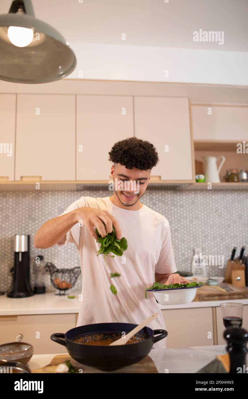 Young smiling man in kitchen hi-res stock photography and images - Alamy