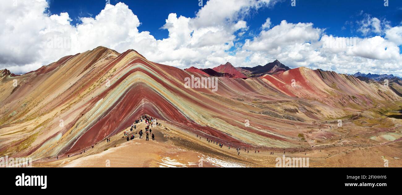 Rainbow mountains or Vinicunca Montana de Siete Colores with people ...