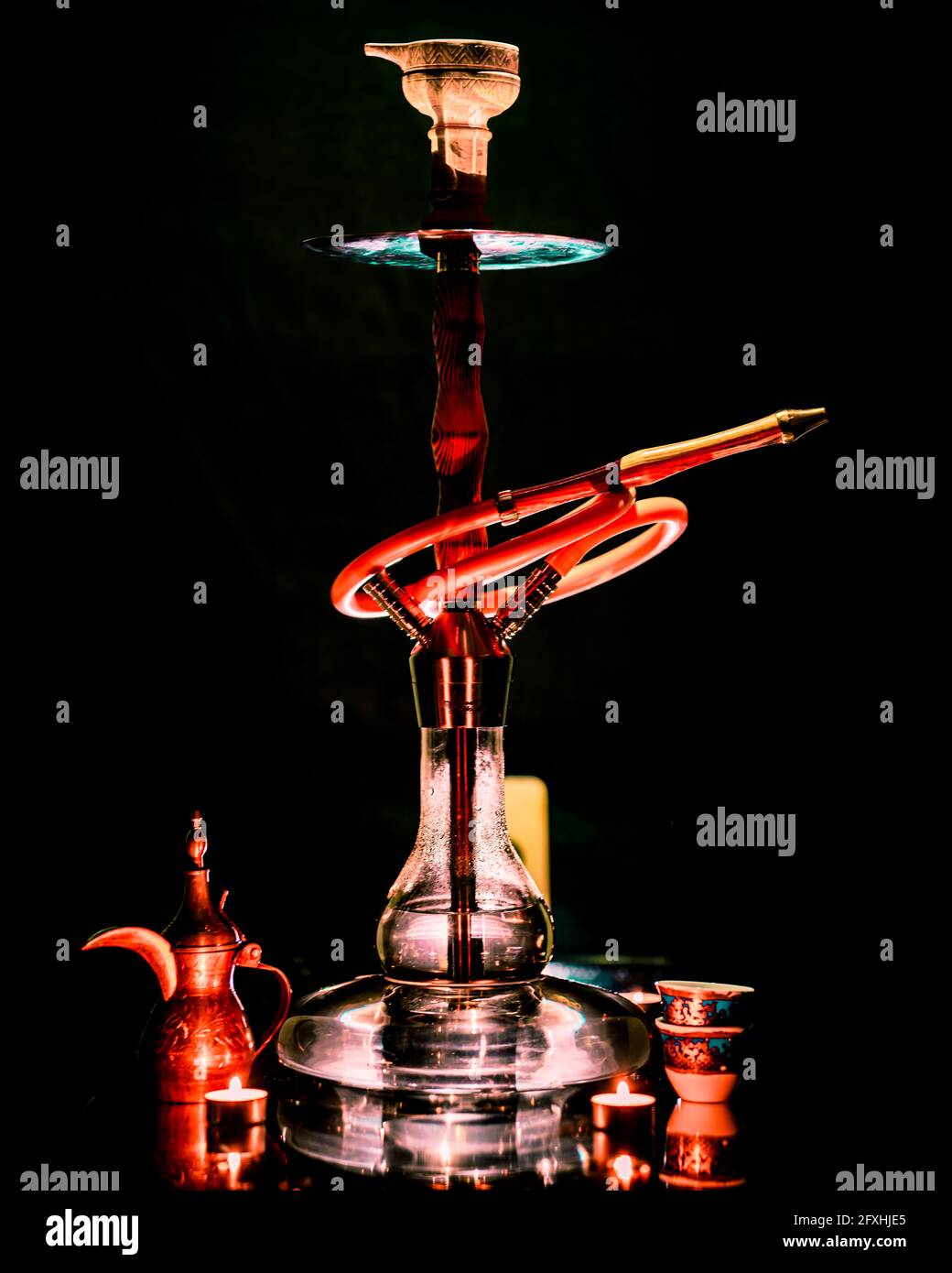 The head of a hookah, water pipe or shisha with glowing coal in the ...
