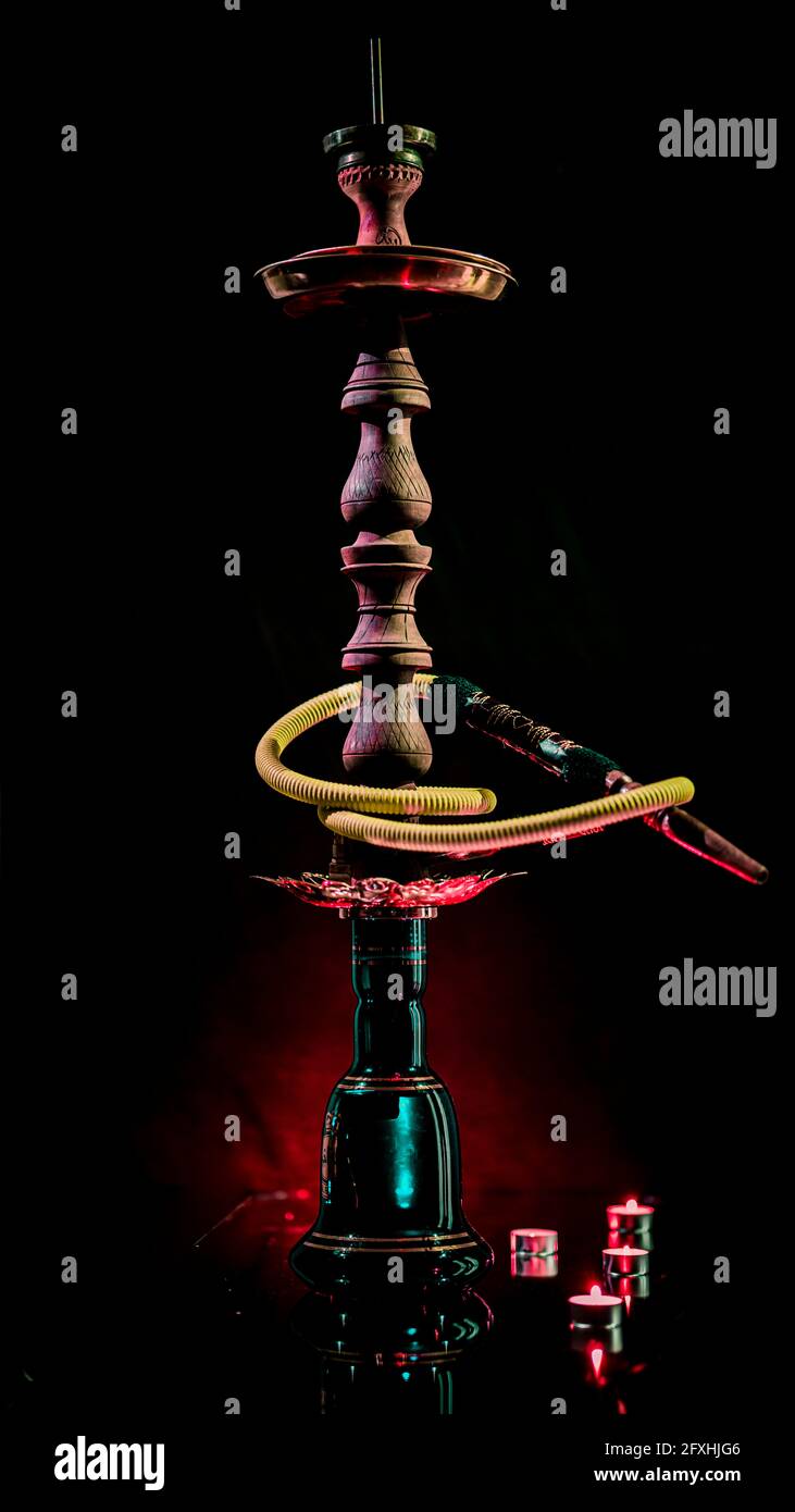 The head of a hookah, water pipe or shisha with glowing coal in the ...