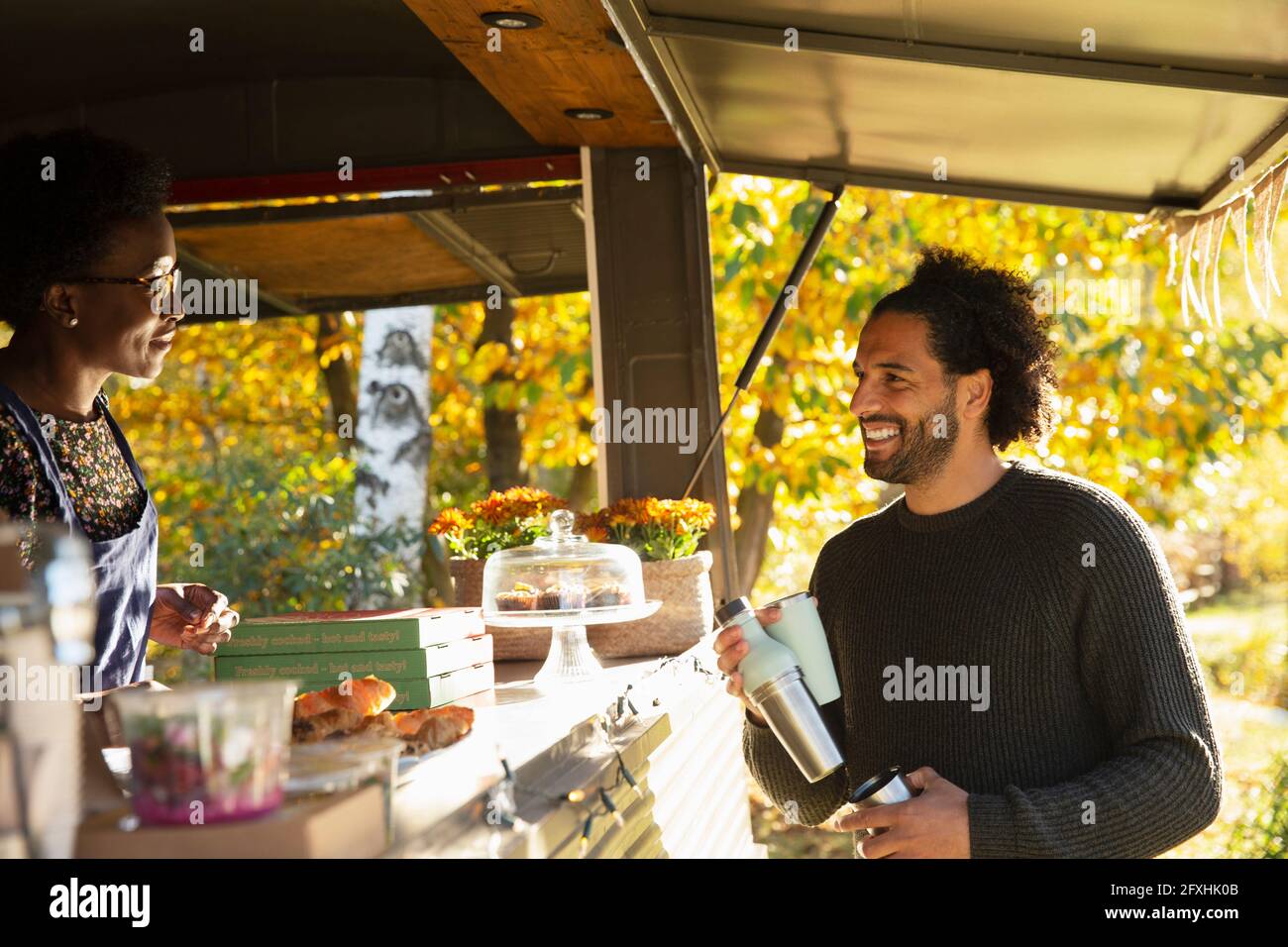 Food truck owner serving customer hi-res stock photography and images ...