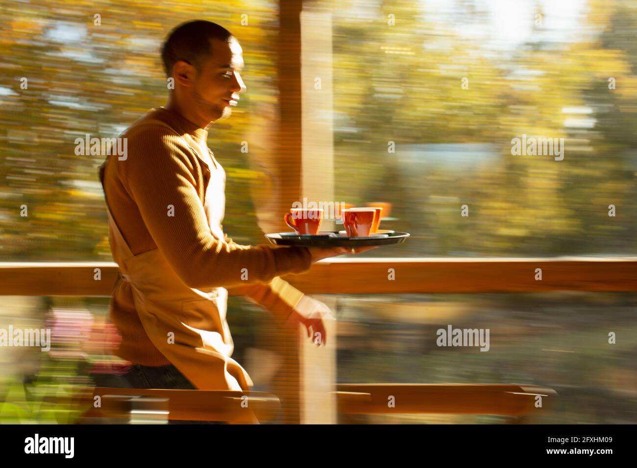 Man carrying tray cups hi-res stock photography and images - Alamy