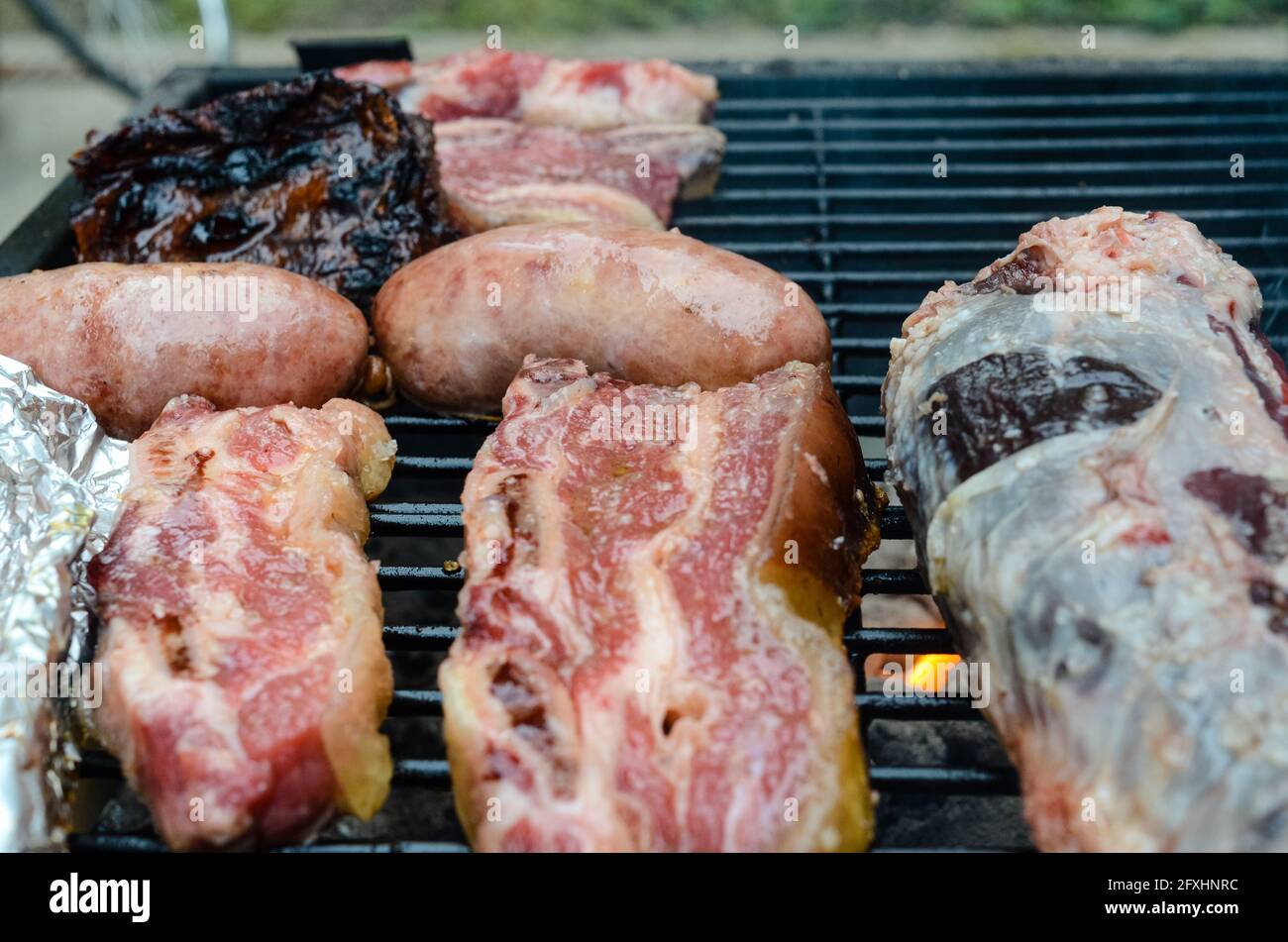 Closeup shot of traditional Argentinian Asado, sausages, and meat ...