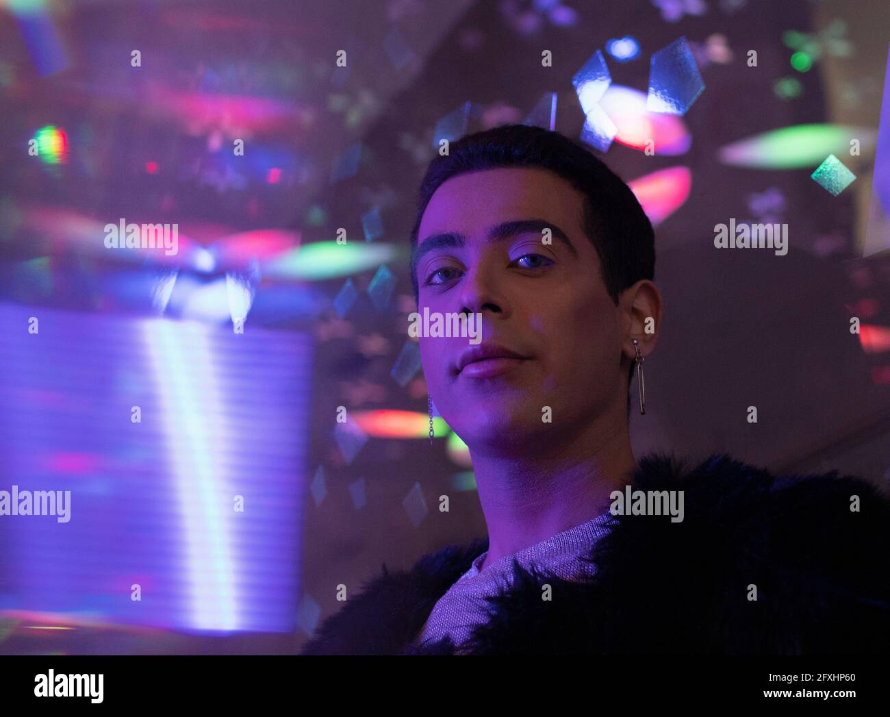 Portrait stylish young man under neon lights in night club Stock Photo ...