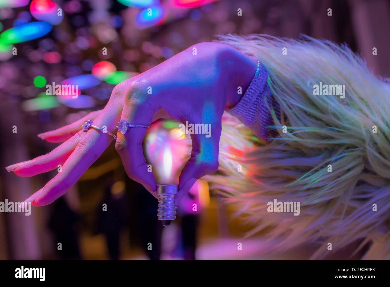 Woman and lightbulb hi-res stock photography and images - Alamy