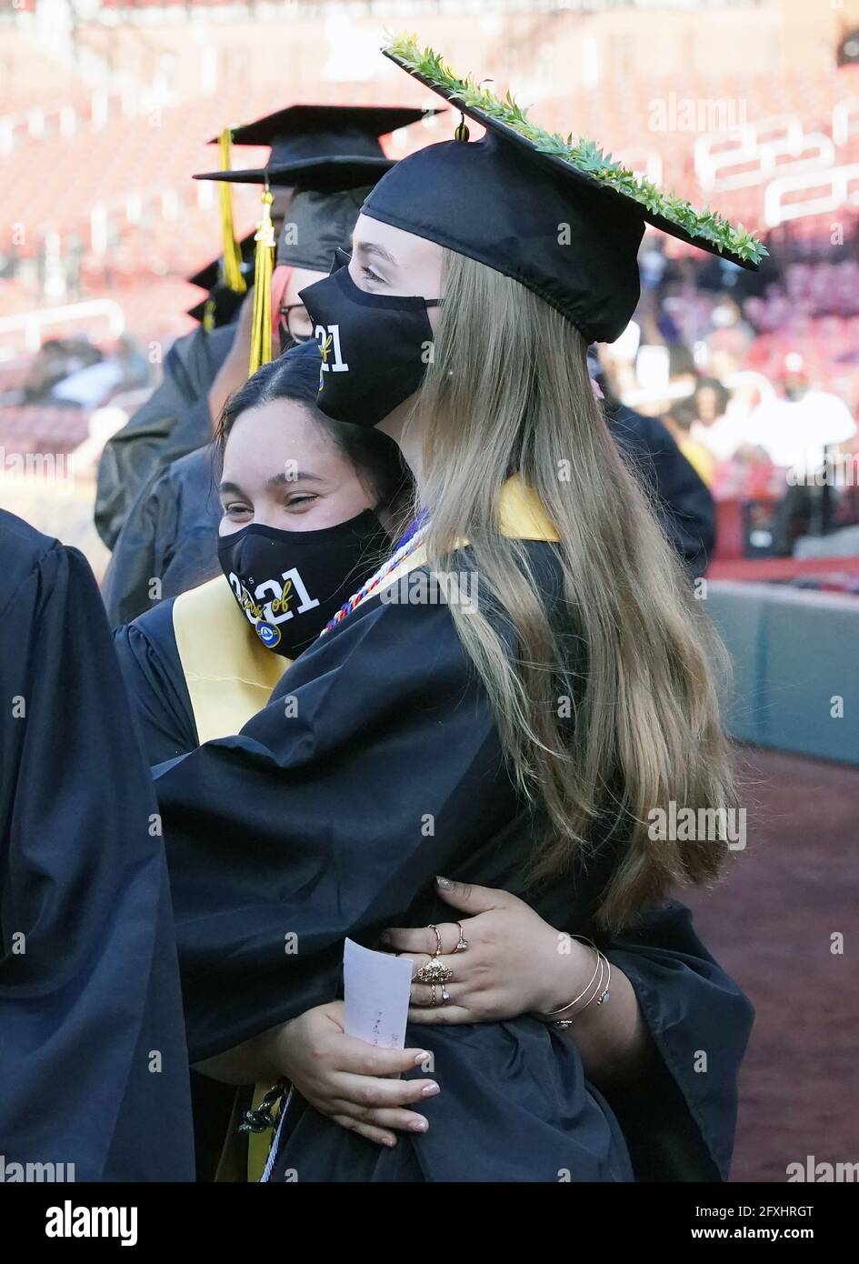 Two McKinley High School graduating seniors hug during the commencement ...