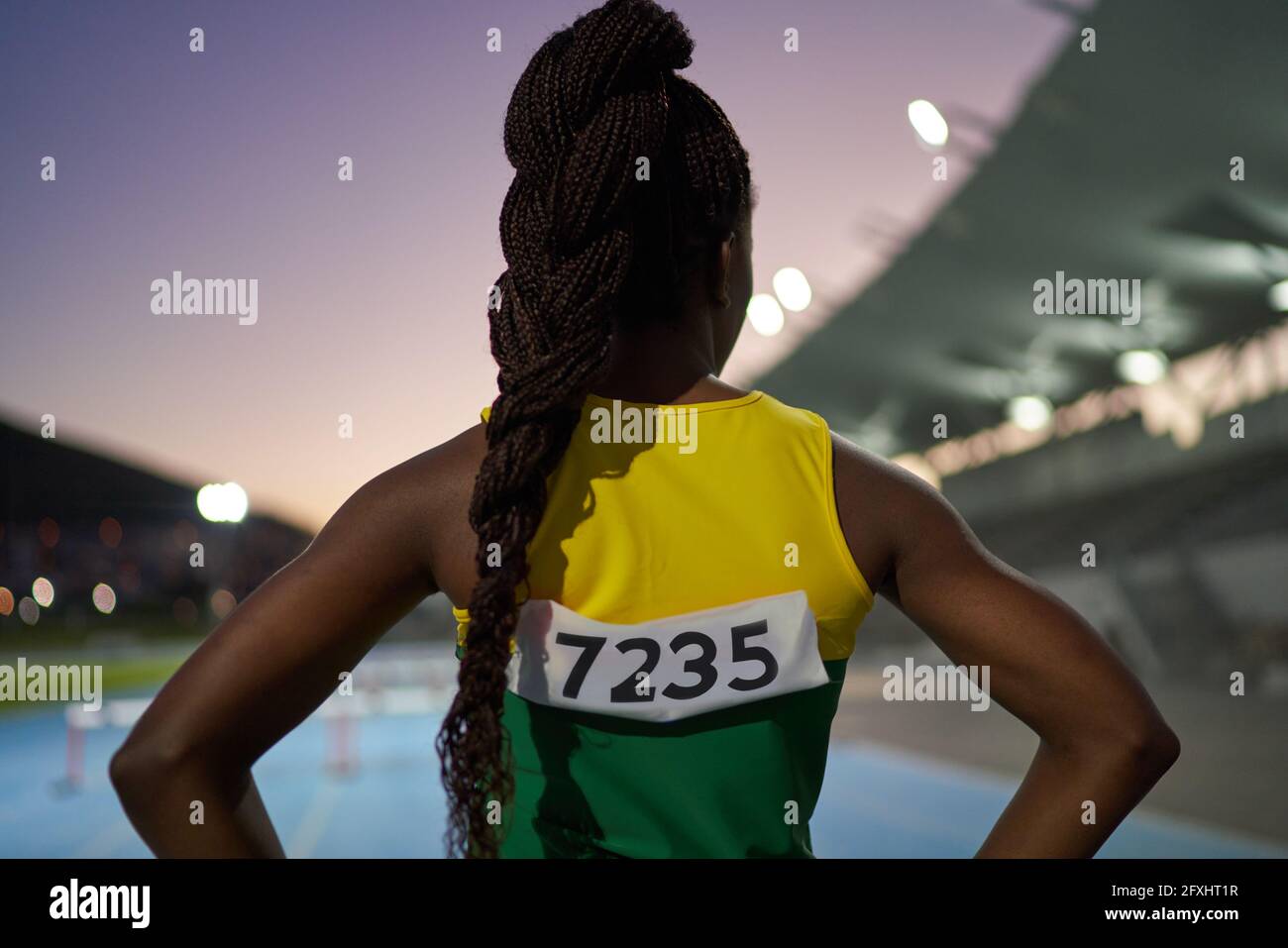 Female track and field athlete with long black braids in stadium Stock ...