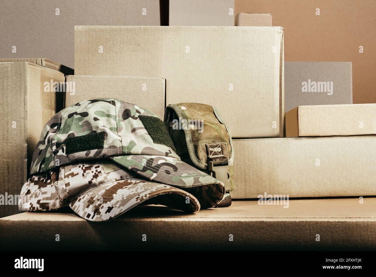 Photo of various military camouflaged caps with pouch laying on stacked ...