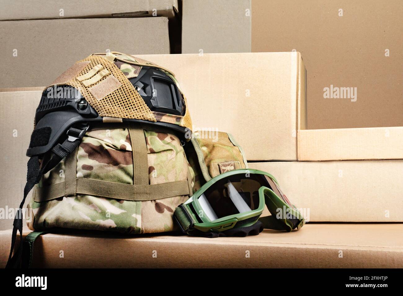 Photo of various military camouflaged armored helmets with covers and ...