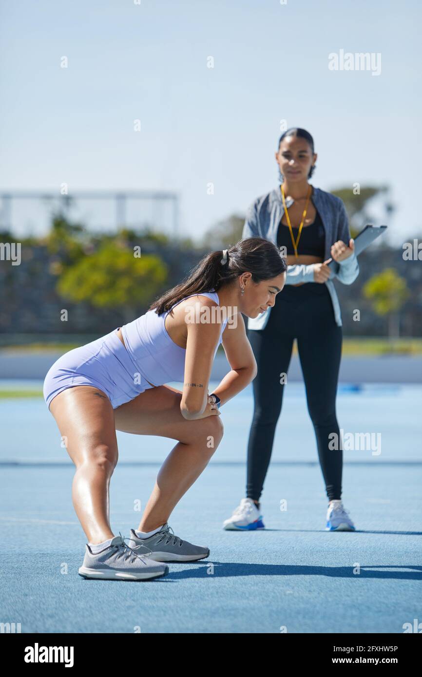 Female athlete stretching on field hi-res stock photography and images ...