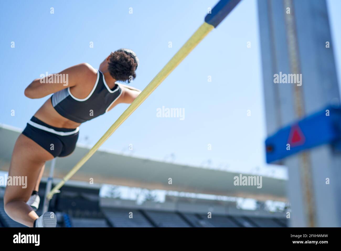 Female track and field athlete high jumping Stock Photo - Alamy