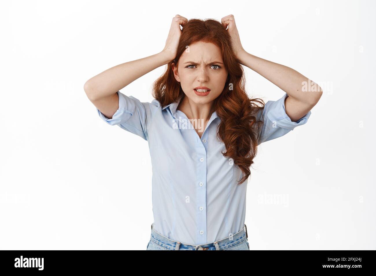 Frustrated and distressed redhead woman have problem, holding hands on ...