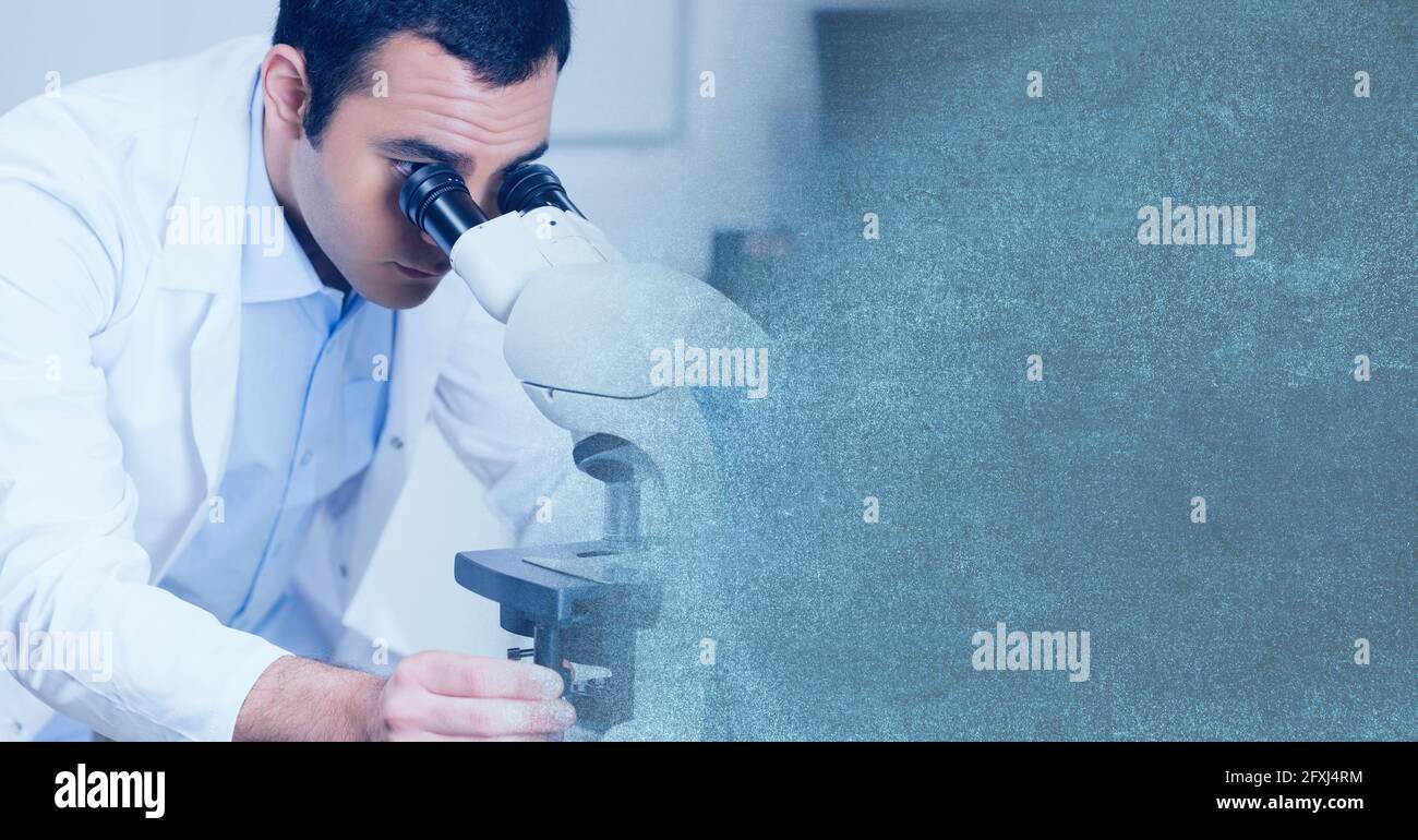 Composition of male lab technician using microscope, with blurred blue ...
