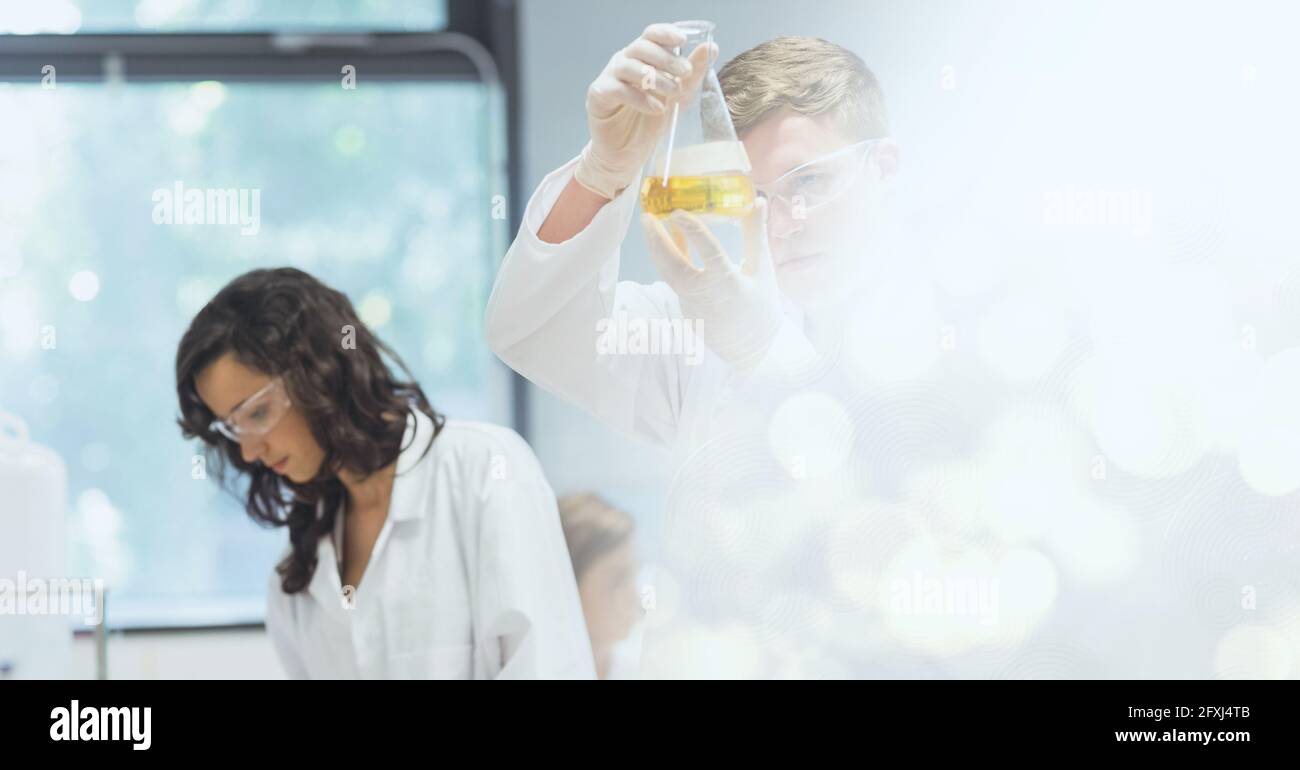 Composition of two female lab technicians at work, with white bokeh copy space to right Stock ...