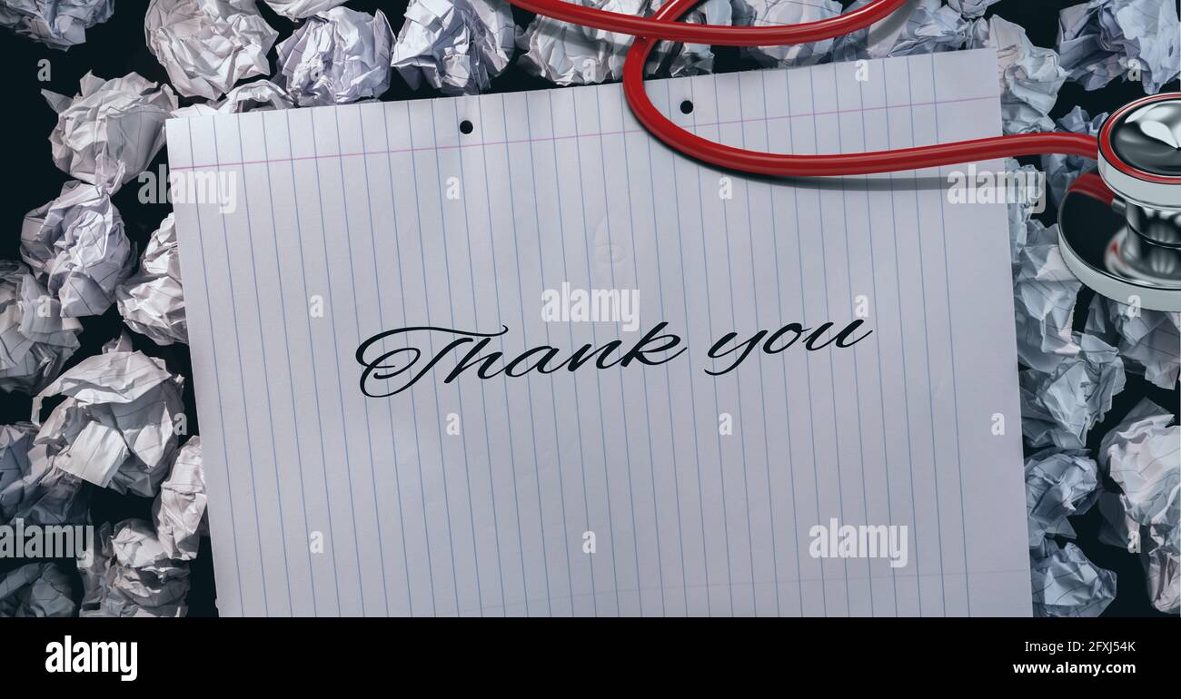 Composition of notebook with thank you note, with scrunched up paper ...