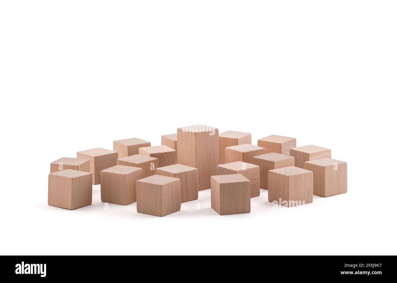 One different higher cube block among wooden blocks isolated on white ...