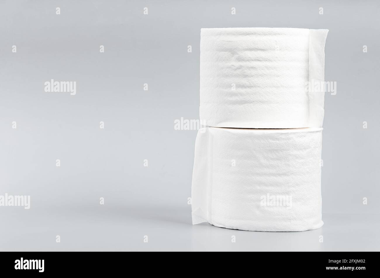 Tissue paper rolls on grey background Stock Photo - Alamy