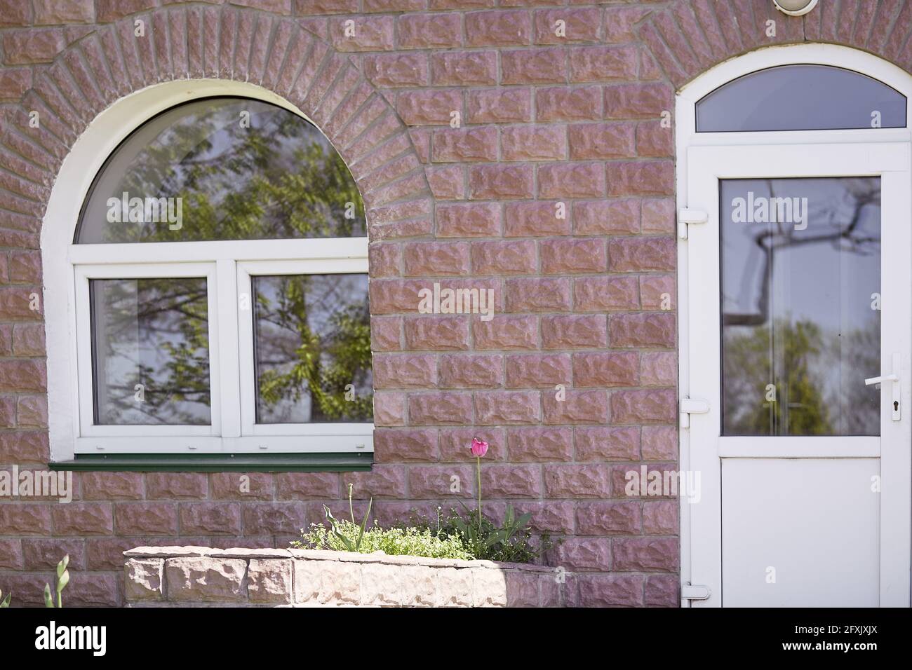 Cute small window and door in sunny day. Architecture exterior design ...