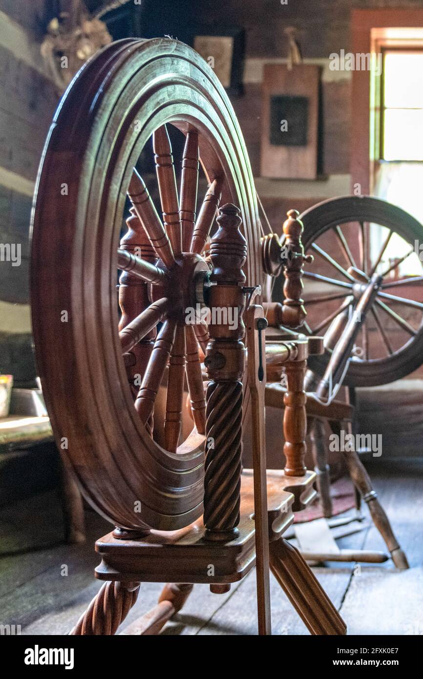 Old colonial wooden threading machine inside a vintage colonial house ...