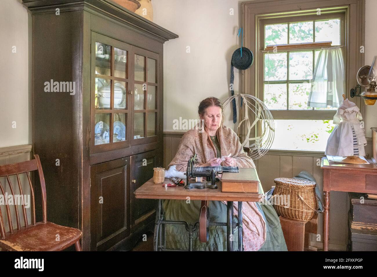The dressmaker woman inside of the McKenzie house. The scene is seen in ...