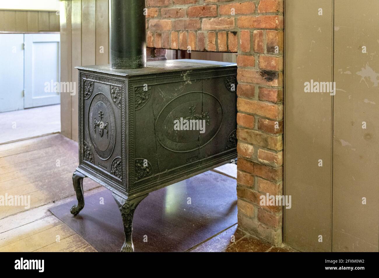 The furnace of an antique heating system inside of a colonial style ...