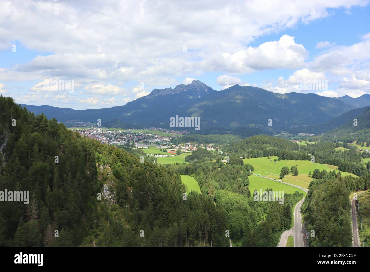 View of the beautiful Reutte town from the historic Ehrenberg Castle in ...