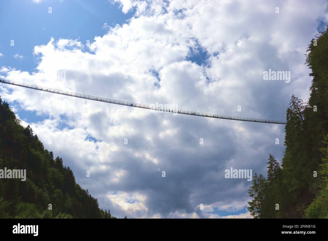 Low angle shot of a suspension bridge in Reutte, Austria under a cloudy ...