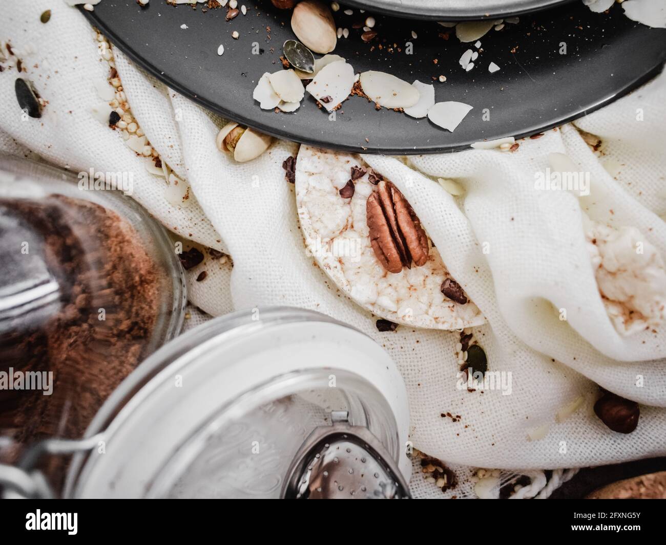 Top view of a messy kitchen table with nuts and grains Stock Photo - Alamy