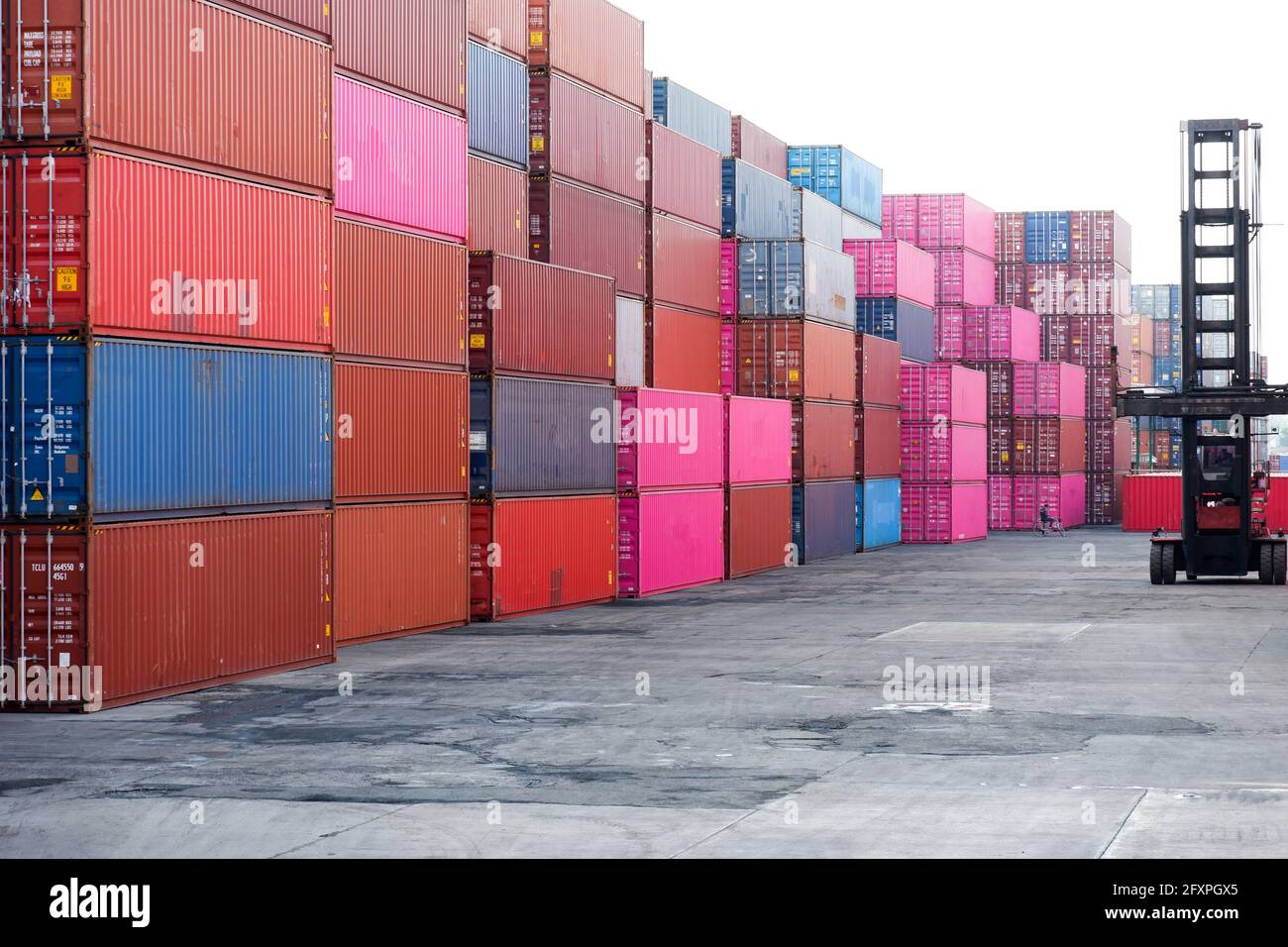 Picture of container handlers and container piles Stock Photo - Alamy