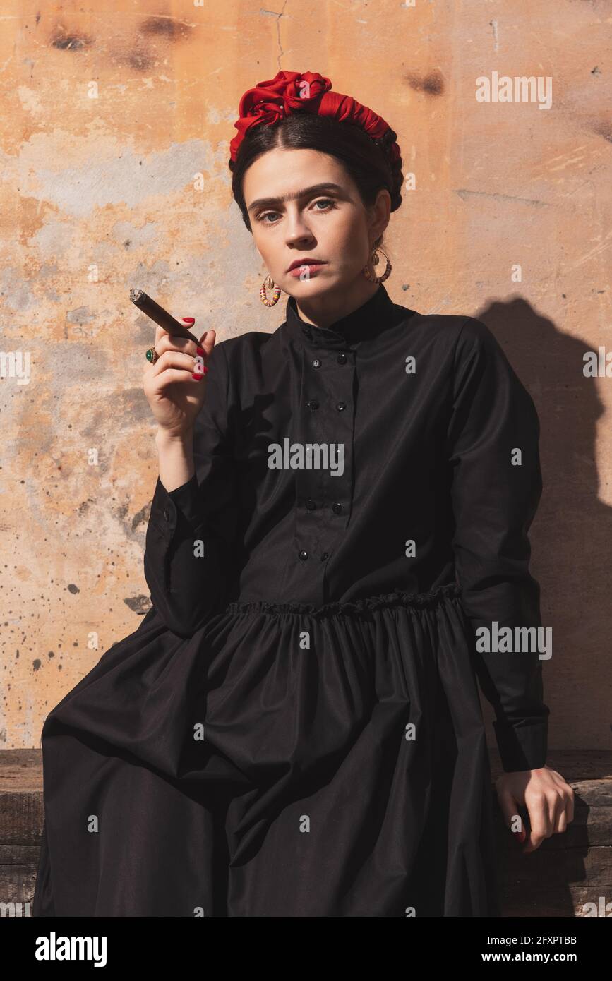 Close- up portrait of young woman in the image of a famous artist ...