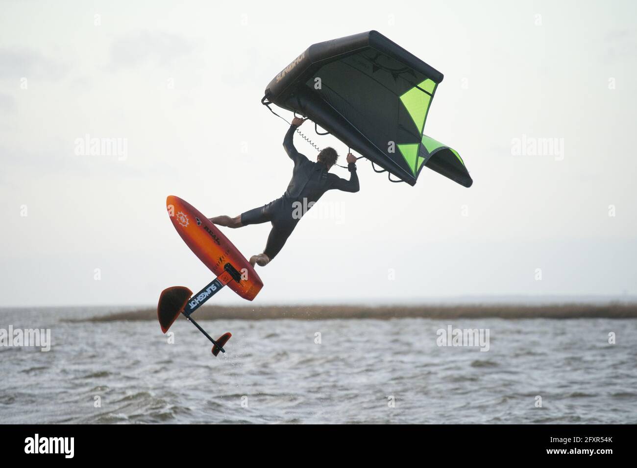 Pro surfer James Jenkins jumps his wing surfer over the Pamlico Sound ...