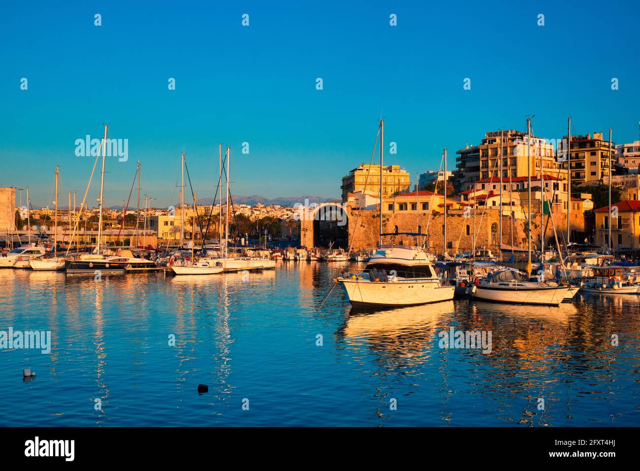 Venetian Fort in Heraklion and moored fishing boats, Crete Island ...