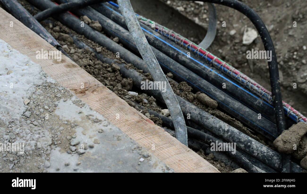 electric cables installed in the ground Stock Photo - Alamy