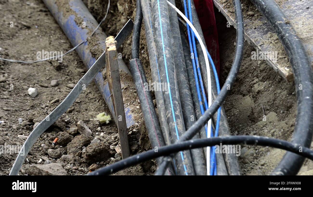 electric cables installed in the ground Stock Photo - Alamy