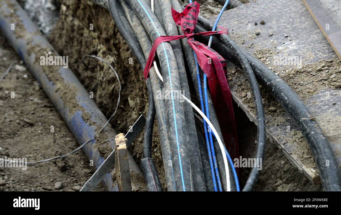 electric cables installed in the ground Stock Photo - Alamy