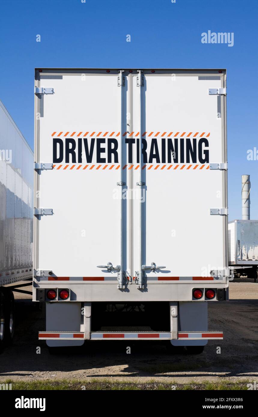 Driver training sign on back of truck Stock Photo - Alamy
