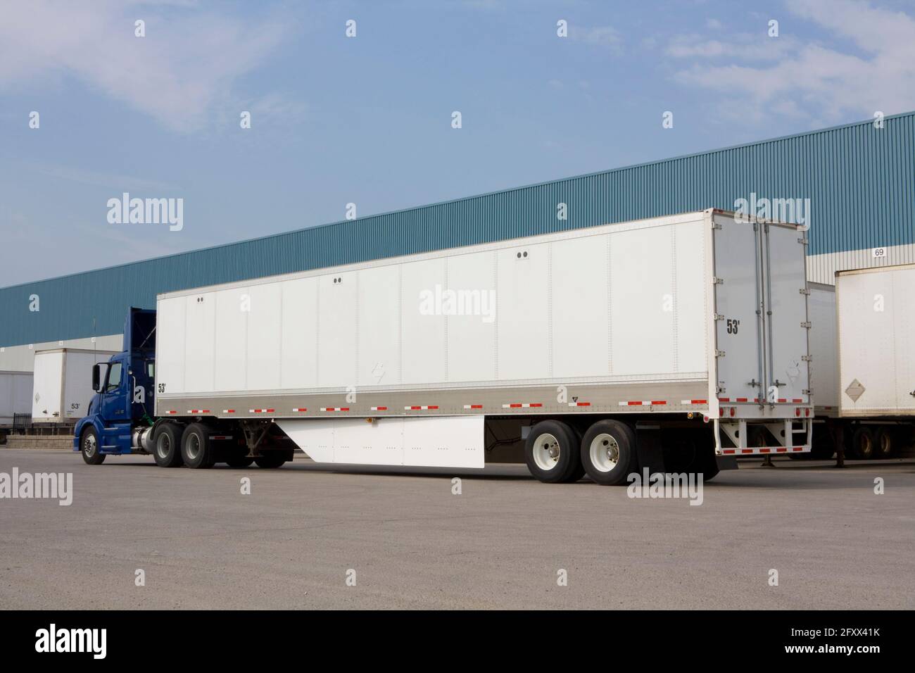 Blue Transport Truck in the Logistics Yard of a Warehouse Stock Photo ...