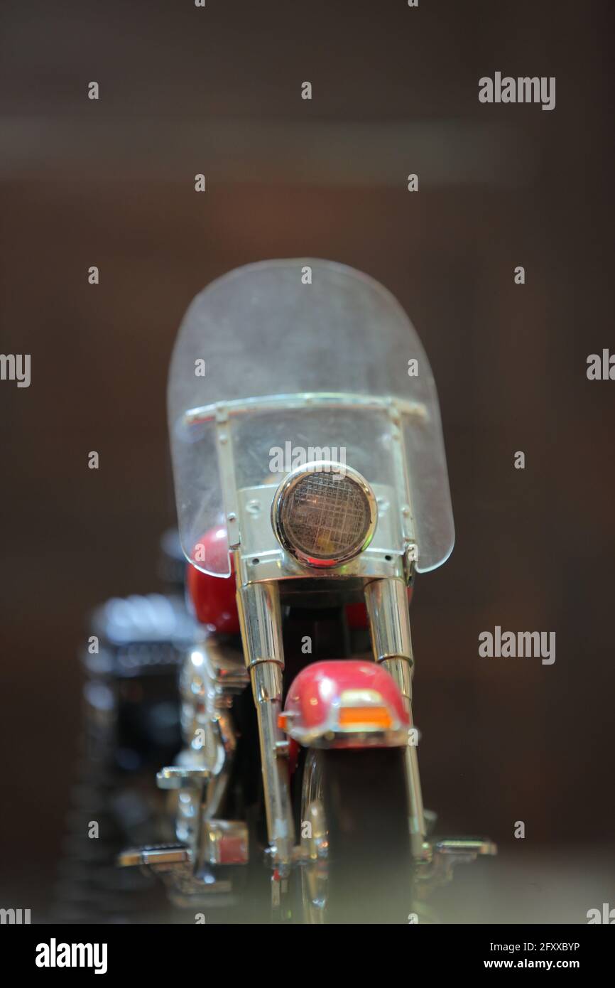 Vertical shot of a vintage motorcycle figurine Stock Photo - Alamy