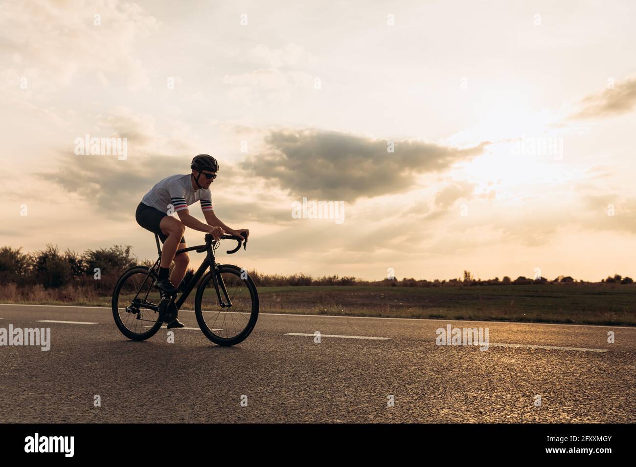 Man ride bike road hi-res stock photography and images - Alamy